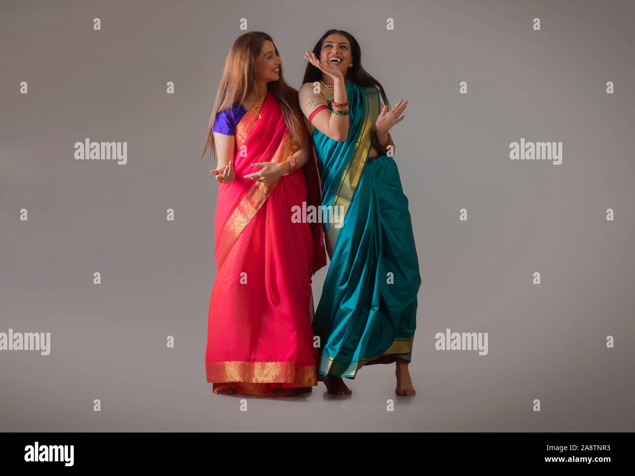 young women dancing in saree Stock Photo - Alamy