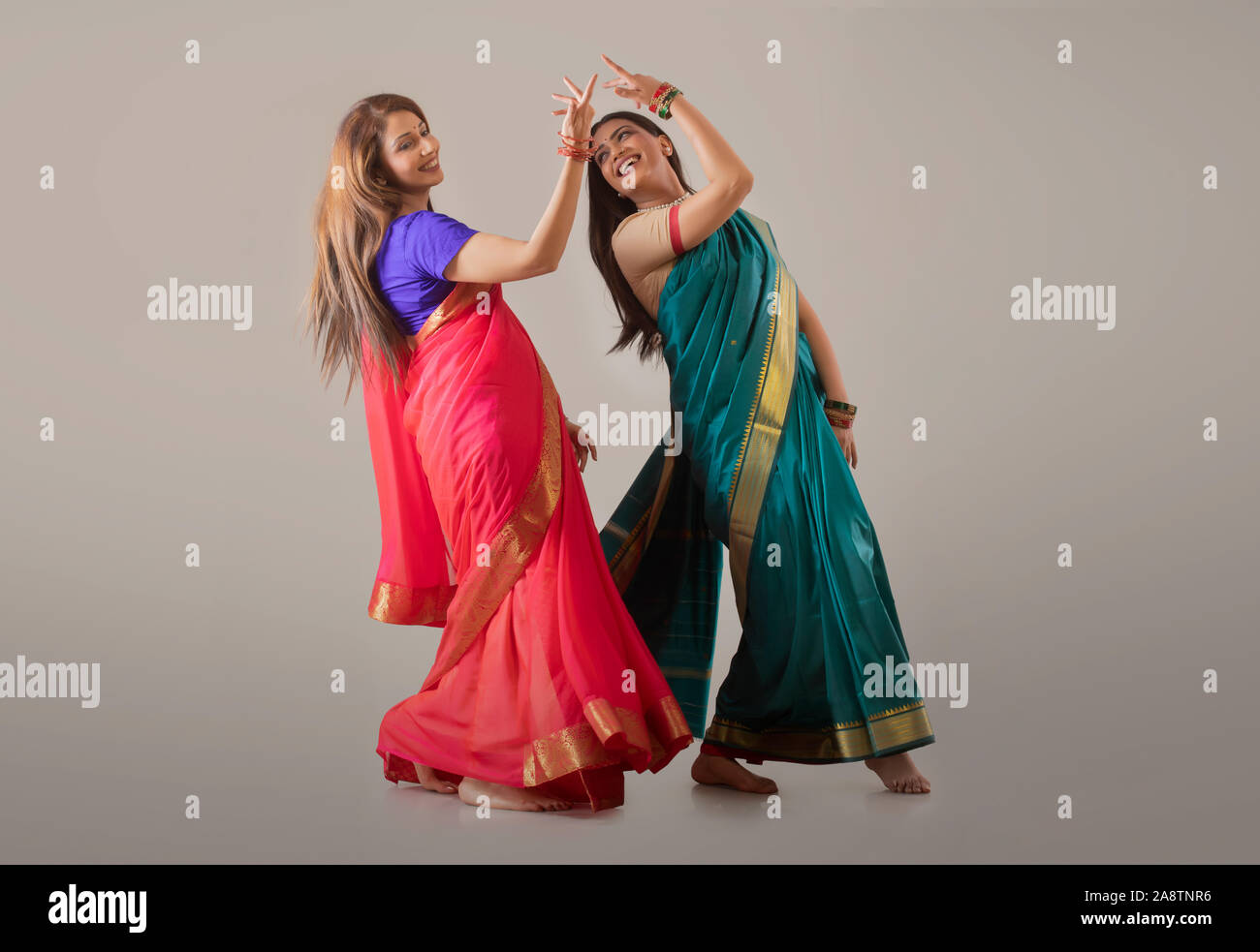 young women dancing in saree Stock Photo - Alamy