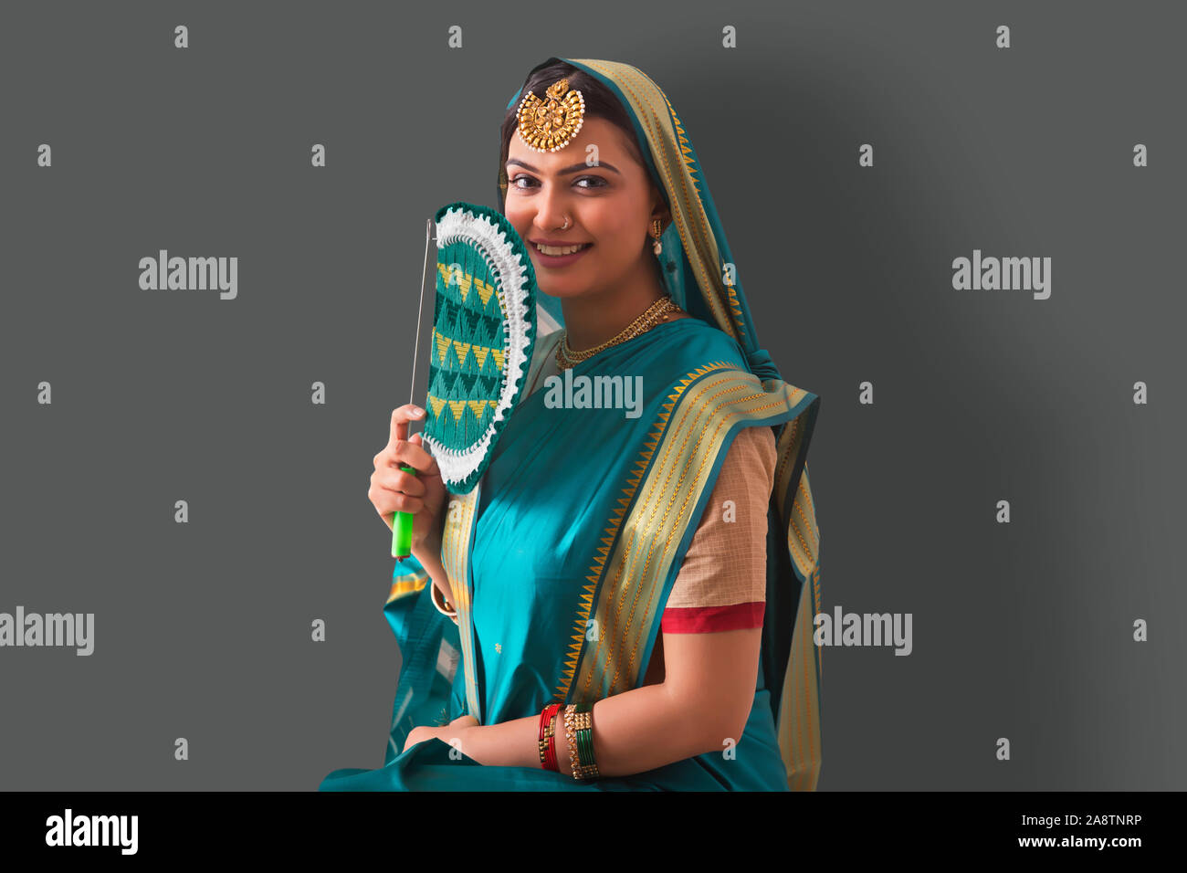 Woman holding fan in hand hi-res stock photography and images - Alamy
