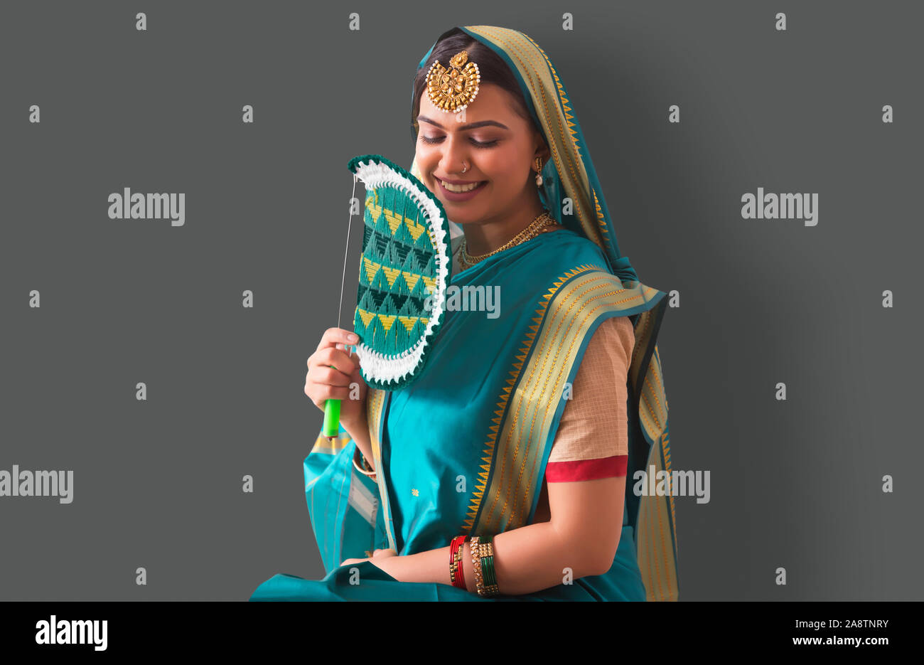 Woman holding fan in hand hi-res stock photography and images - Alamy