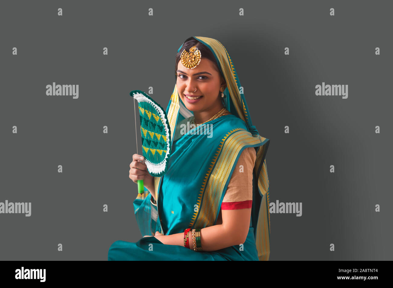 Indian hand holding fan indian hi-res stock photography and images - Alamy