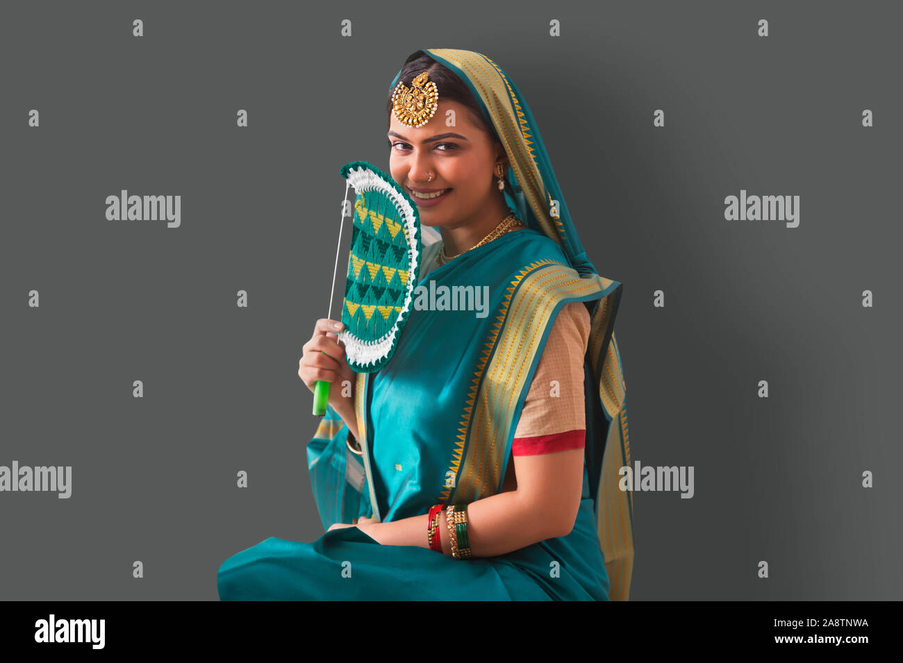 Indian hand holding fan indian hi-res stock photography and images - Alamy