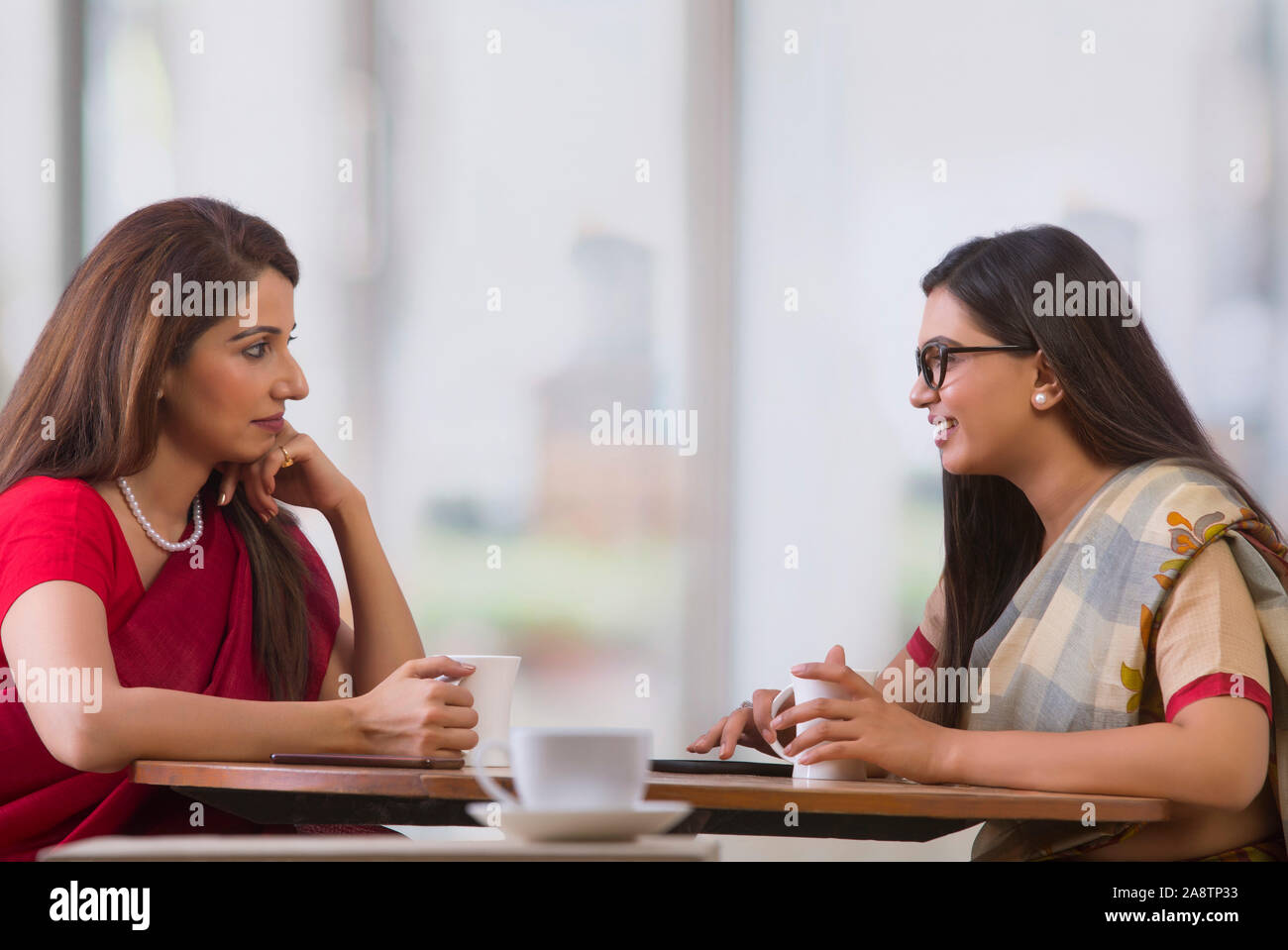 two colleagues having tea Stock Photo - Alamy