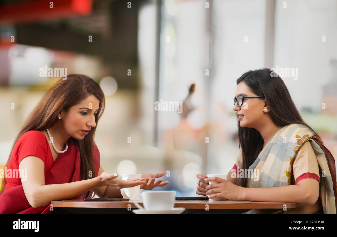 two colleagues having tea Stock Photo - Alamy