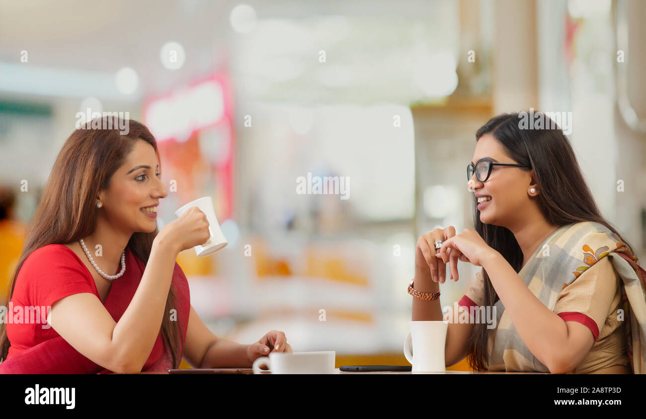 two colleagues having tea Stock Photo - Alamy