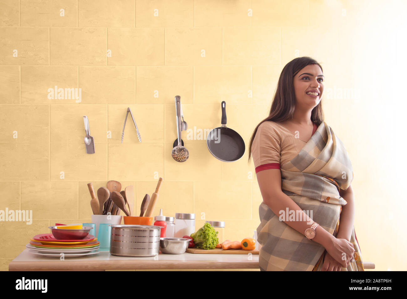 Indian mom in kitchen hi-res stock photography and images - Alamy