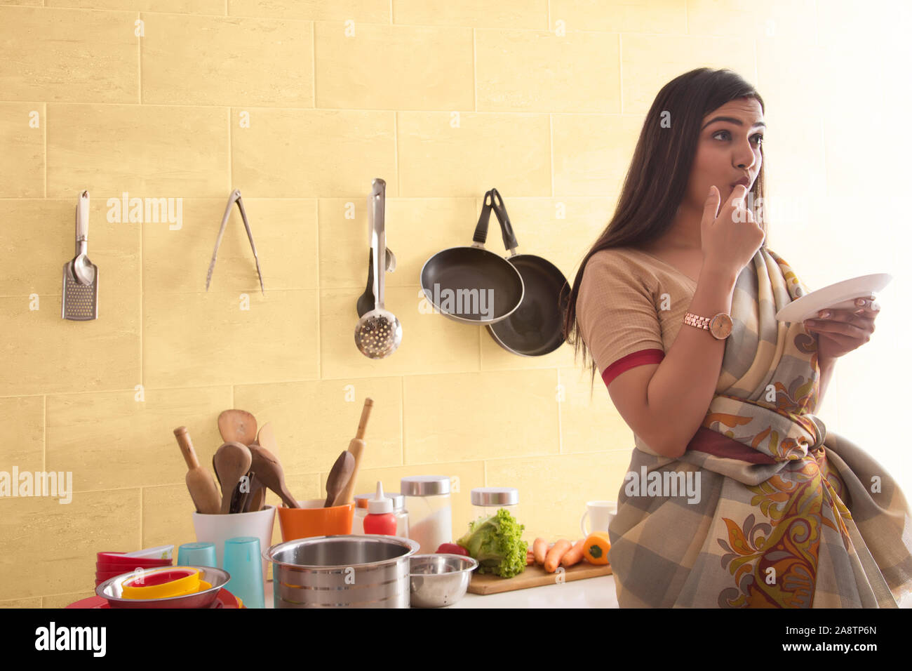 Indian mom in kitchen hi-res stock photography and images - Alamy