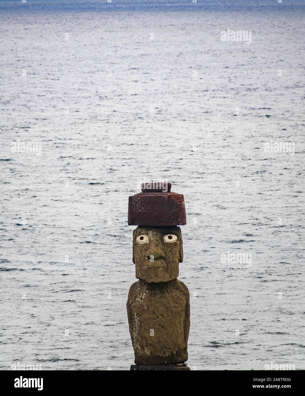 Isolated Moai statue with ocean in the background Stock Photo - Alamy