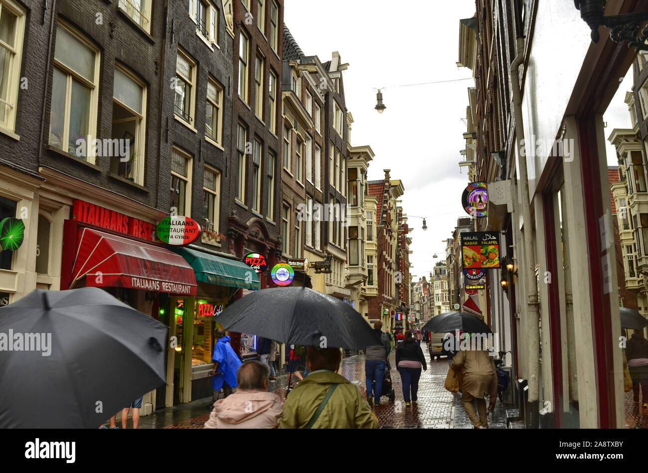 Amsterdam, Holland, August 2019. The alleys of the old town on a rainy ...