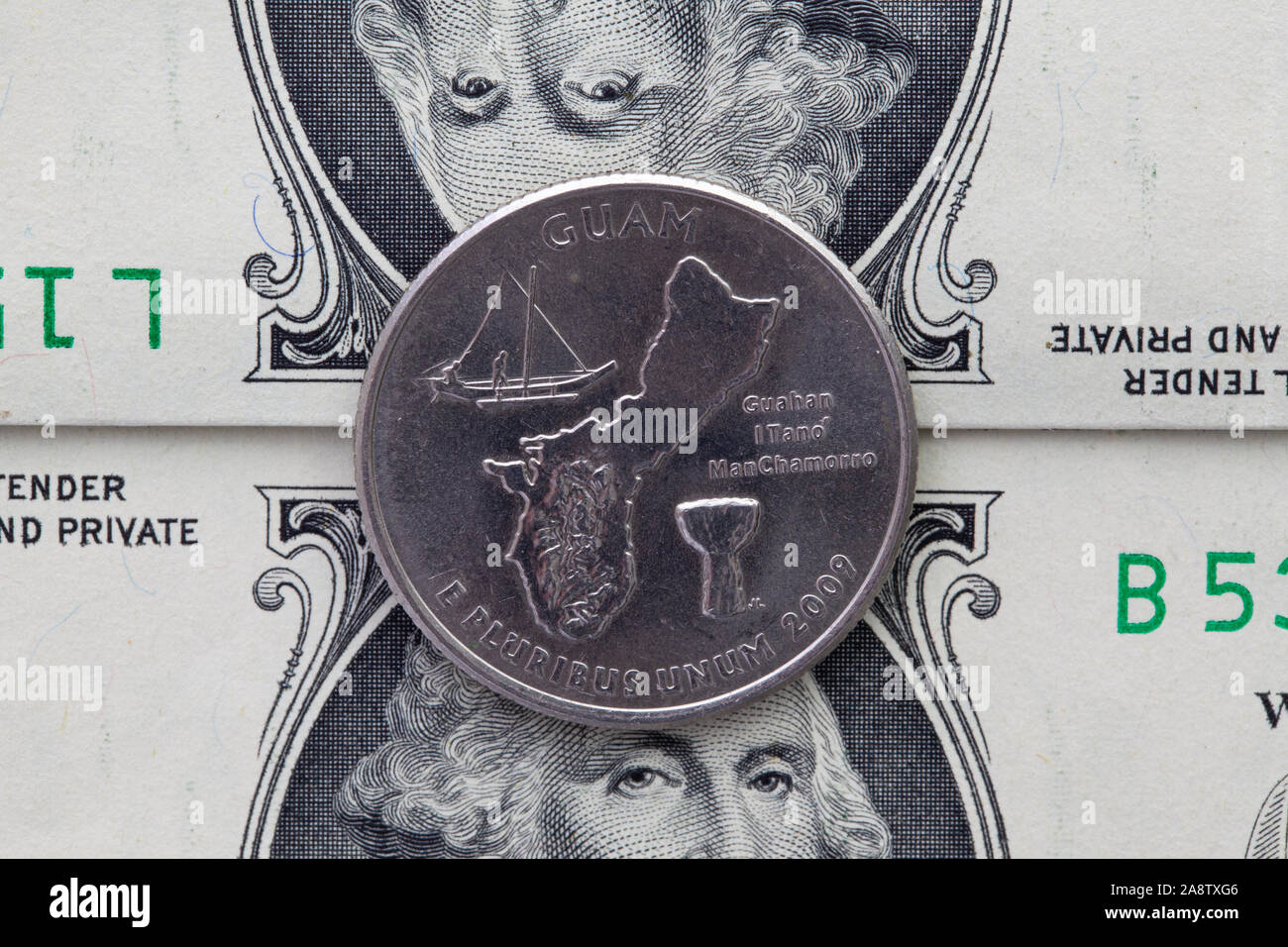 A quarter of Guam on US dollar bills. Symmetric composition of US ...