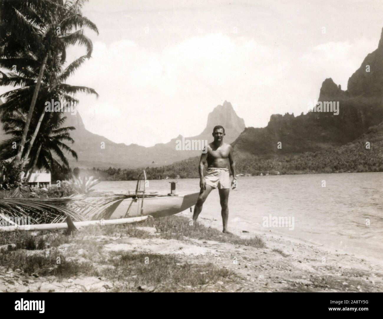 Man on the beach, Moorea, French Polynesia 1956 Stock Photo - Alamy