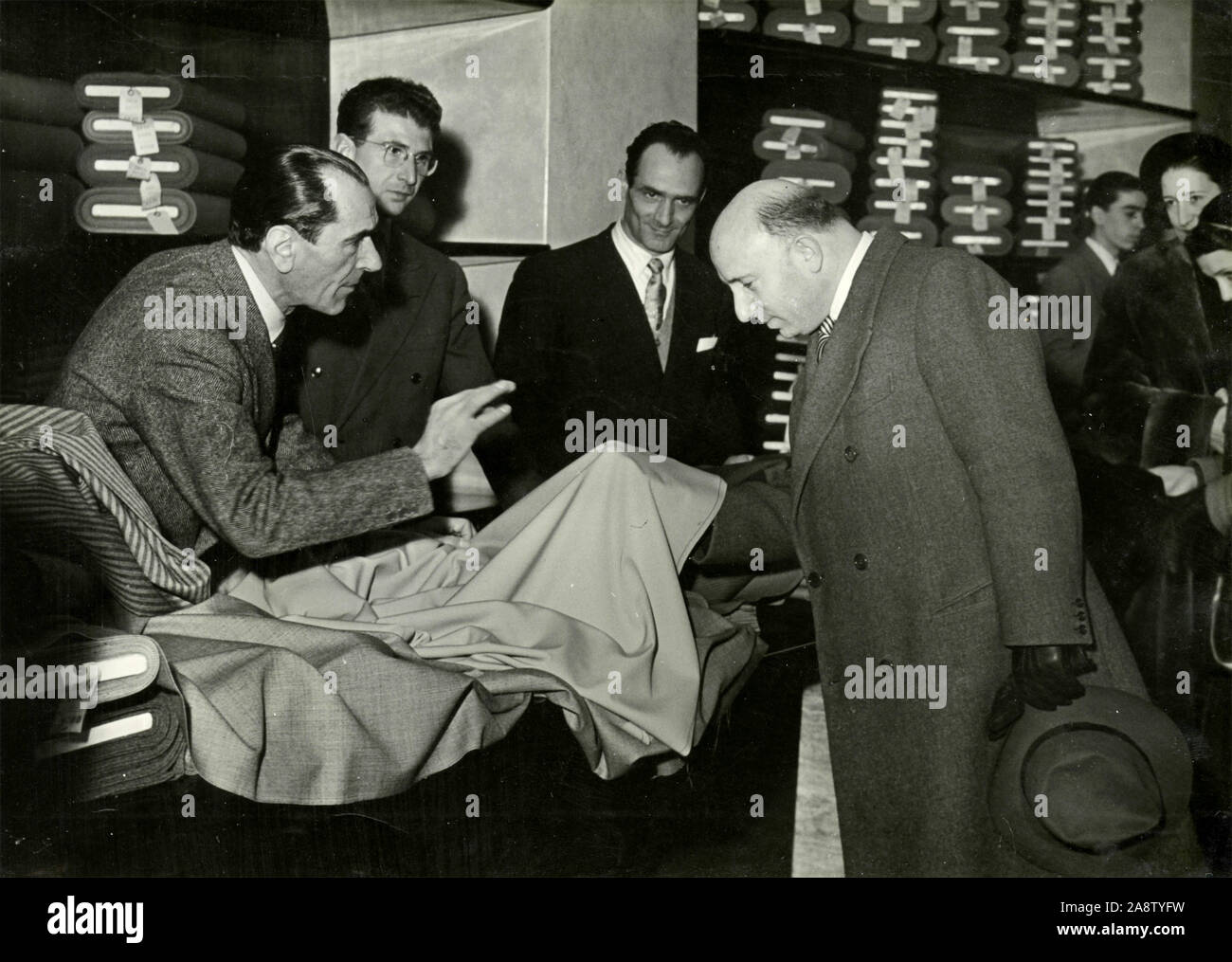 Italian politician Mario Scelba during a visit to a fabric shop, Milan ...