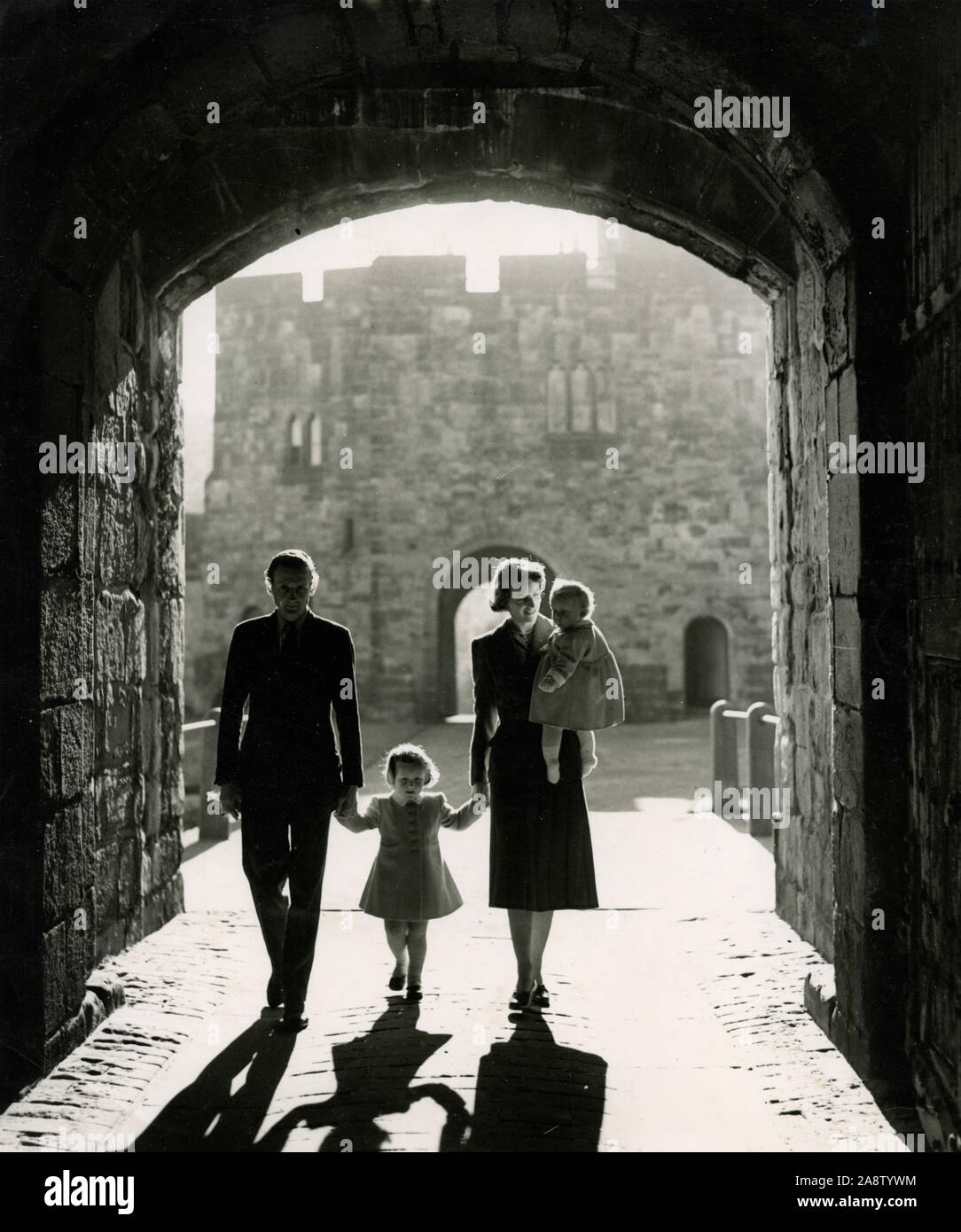 The duke of Northumberland with his wife and children walking through ...