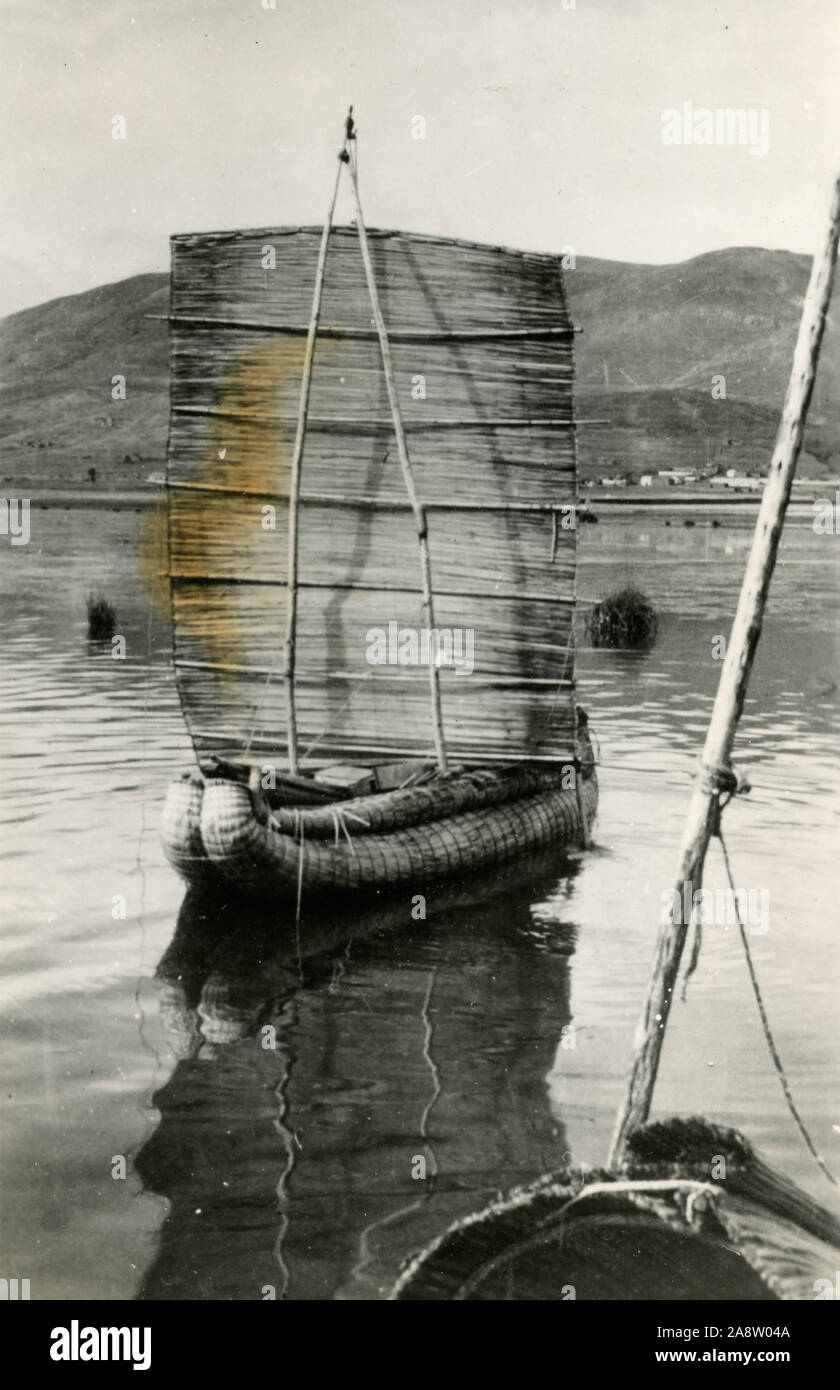 Bolivian traditional canoe on lake Titicaca, Bolivia 1950s Stock Photo ...