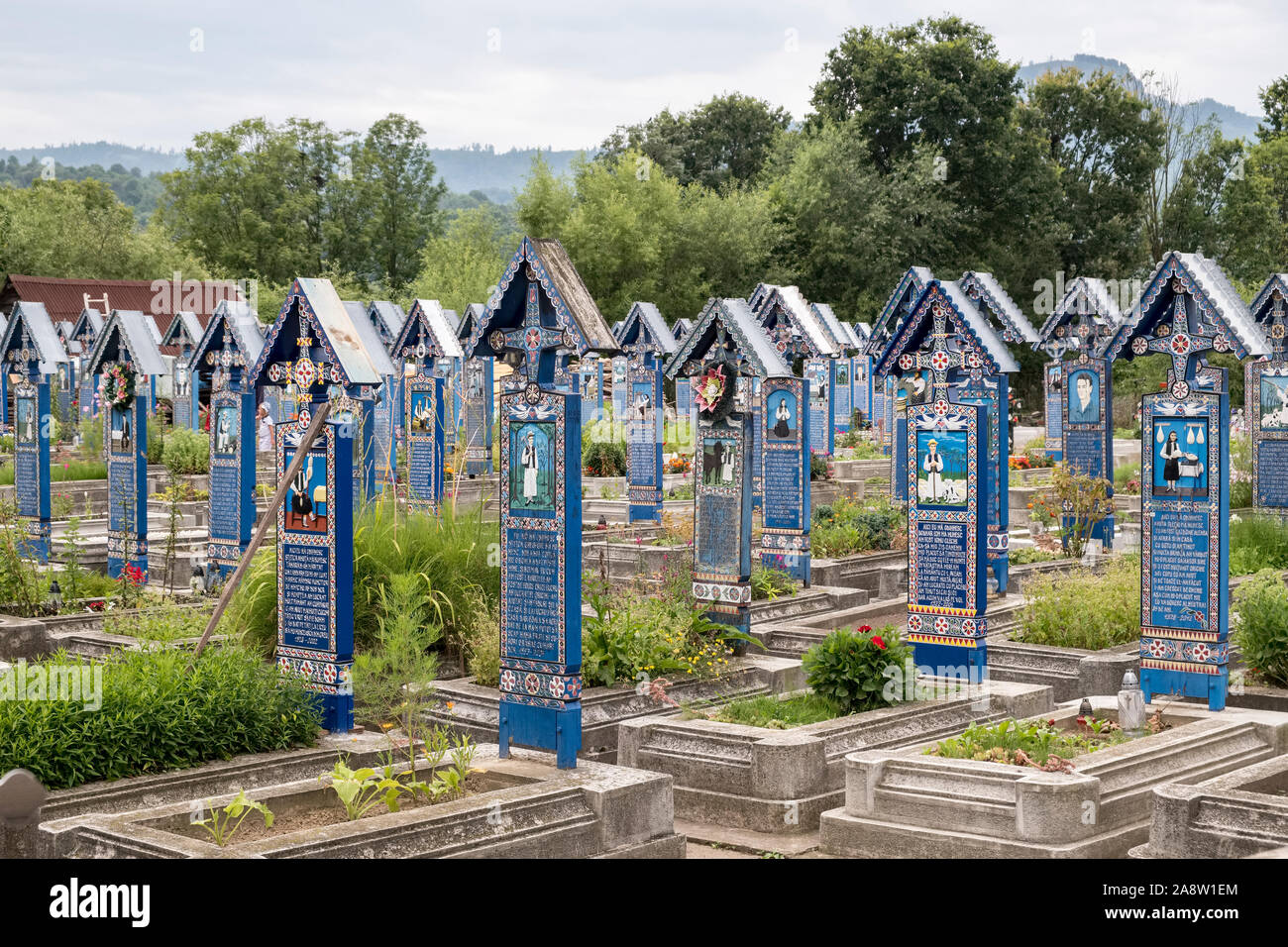 Carved and painted wooden crosses in the famous Merry Cemetery in the ...