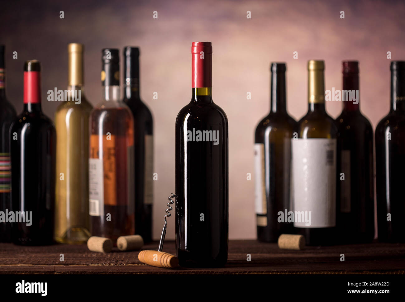 Wine buttles collection on dark background Stock Photo - Alamy