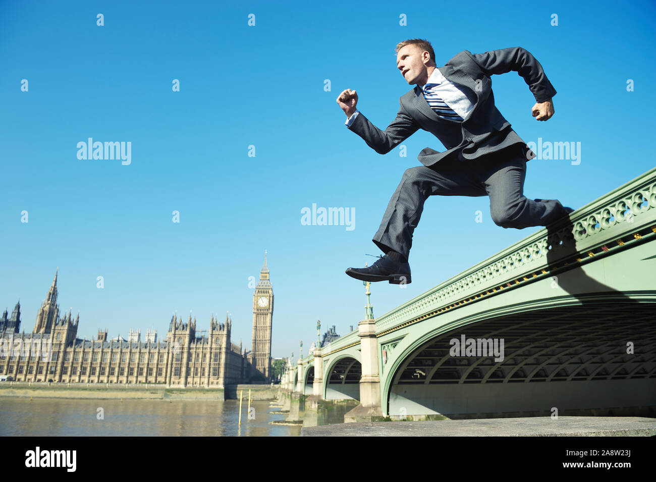Giant British businessman doing a running leap over Westminster Bridge ...