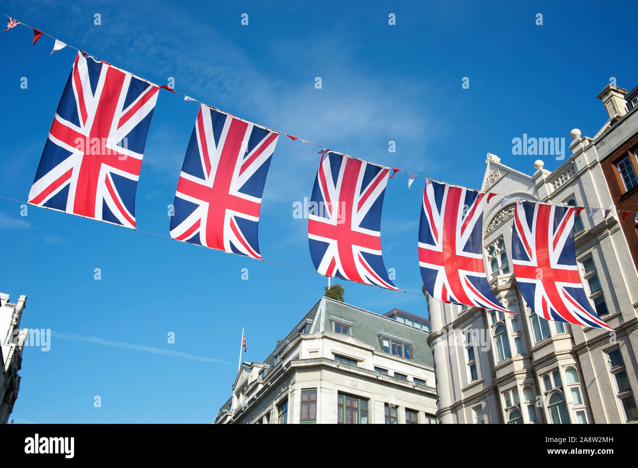 Union Jack flag decorations strung above the streets of London, UK ...
