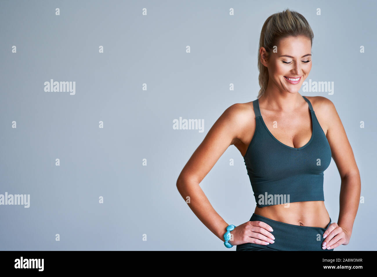 Adult woman practising yoga at home Stock Photo - Alamy