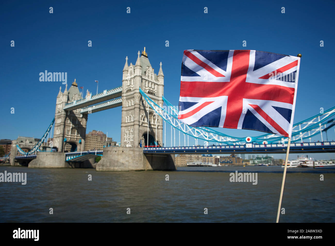 British Union Jack flag flying in front of classic blue sky view of ...