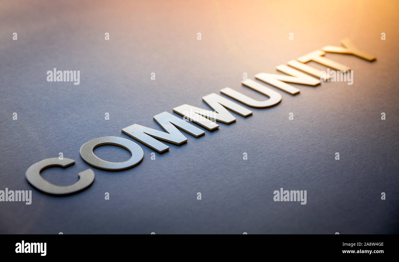 Word community written with white solid letters on a board Stock Photo ...