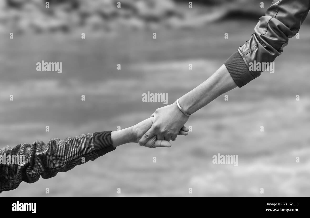 Helping each other Black and White Stock Photos & Images - Alamy