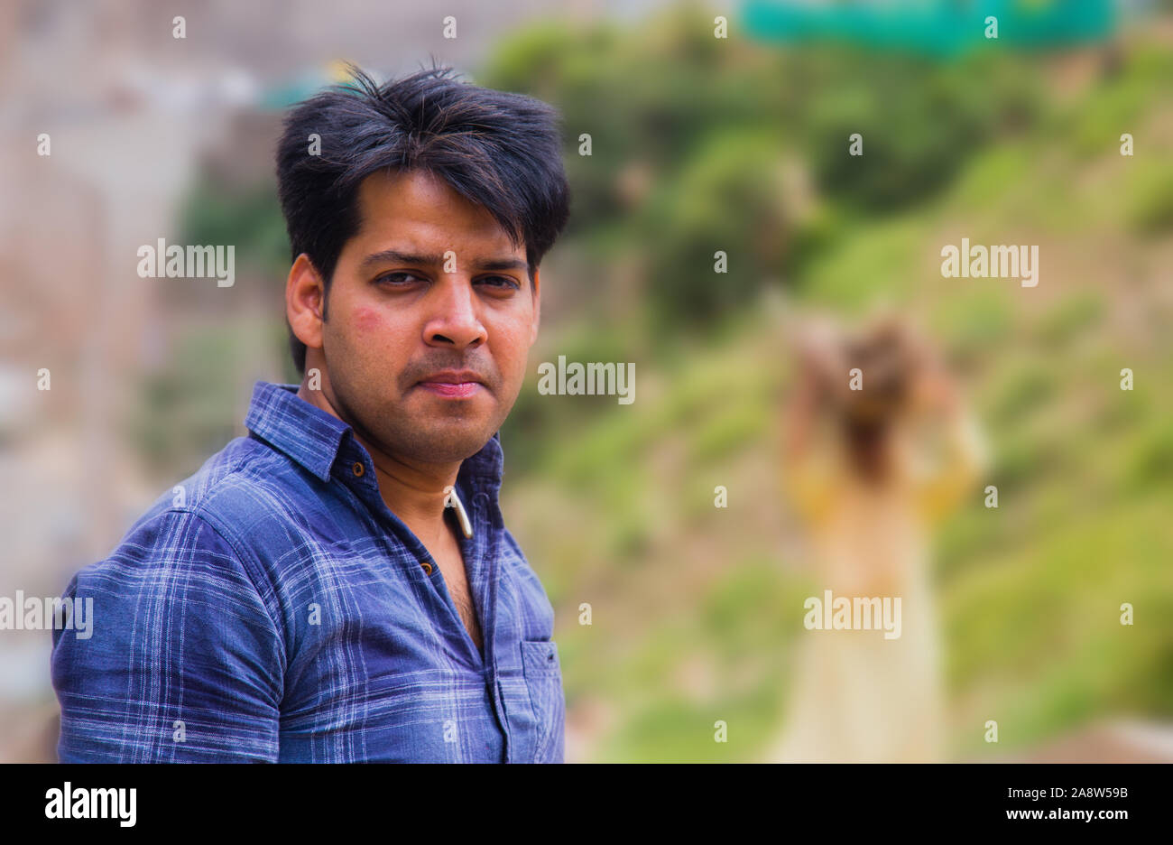 Closeup portrait, young happy handsome man portrait, outdoor in nature ...
