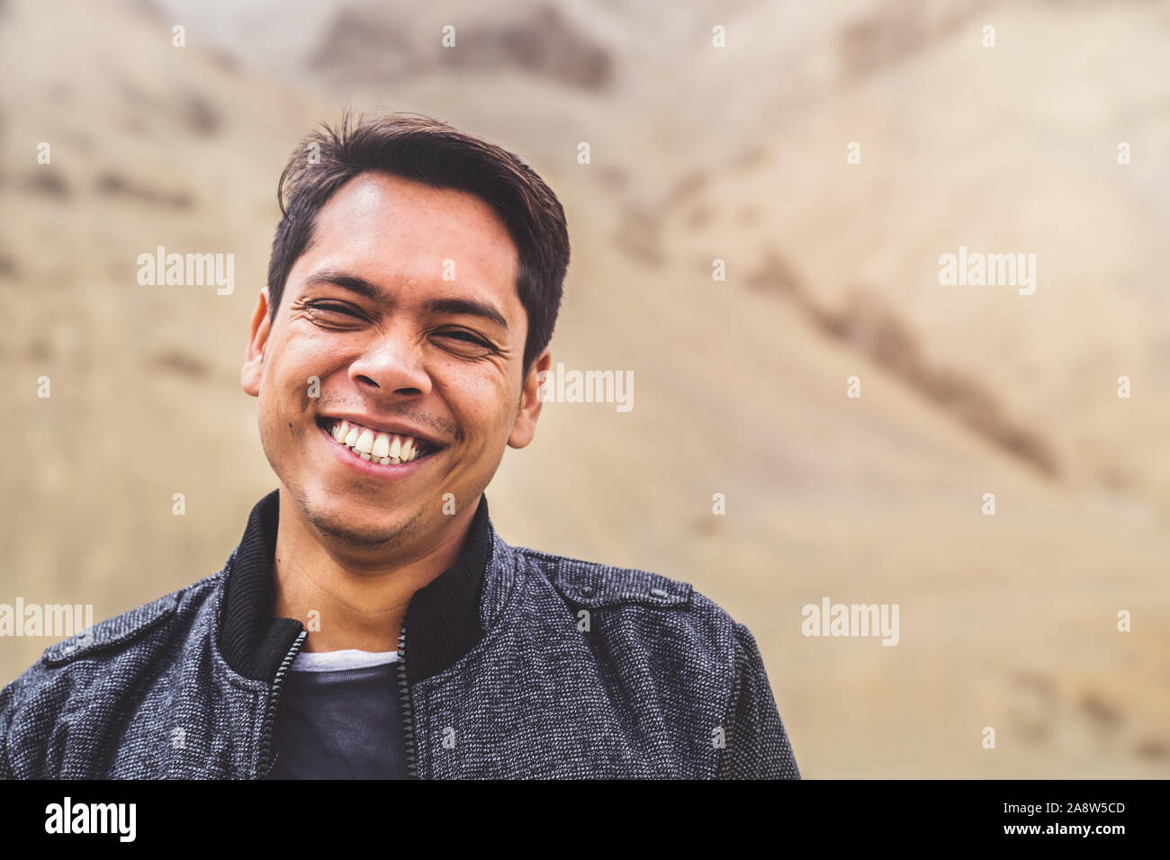 Closeup portrait, young happy handsome man portrait, outdoor in nature ...