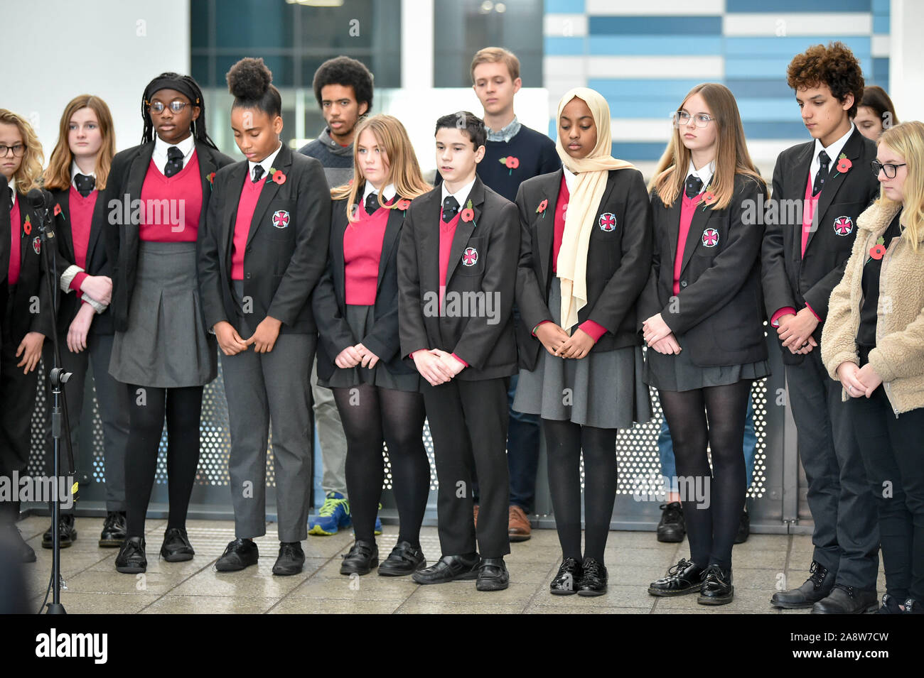 Students fall silent as they pay their respects during the two minutes ...