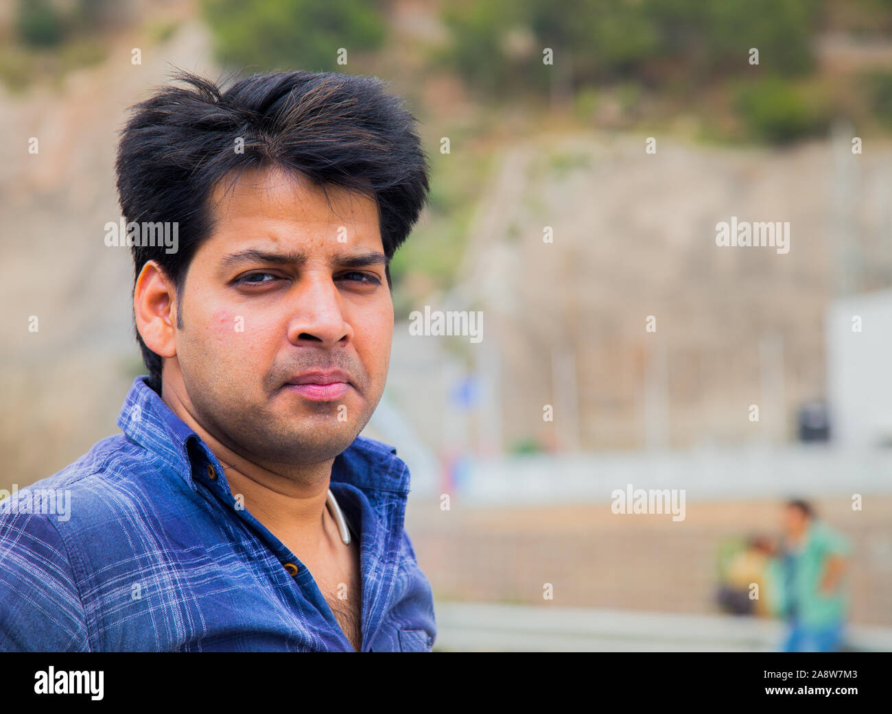 Closeup portrait, young happy handsome man portrait, outdoor in nature ...
