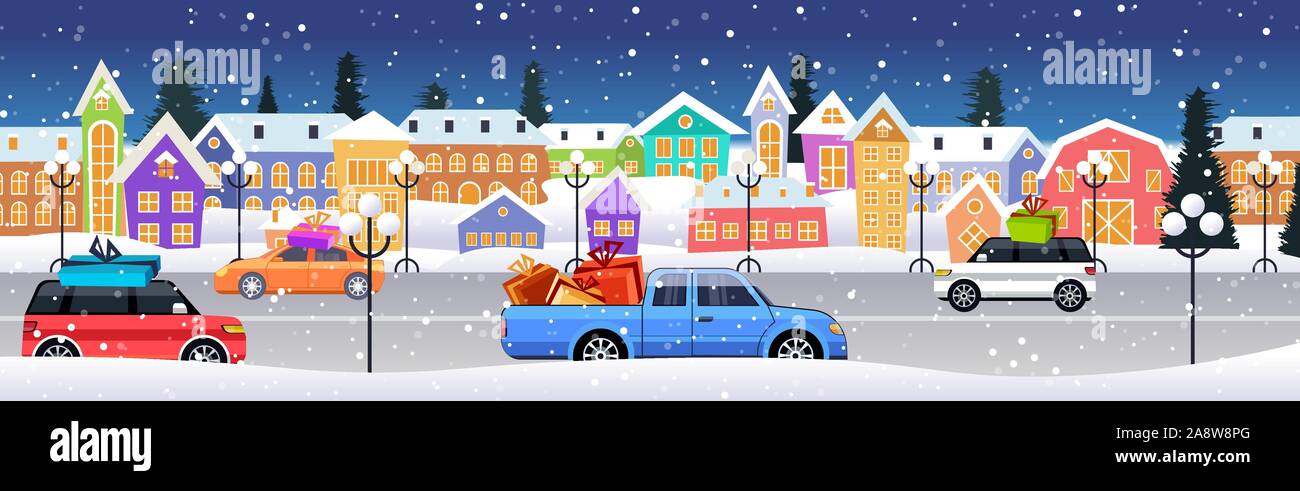 cars with gift boxes driving road over winter city street merry ...