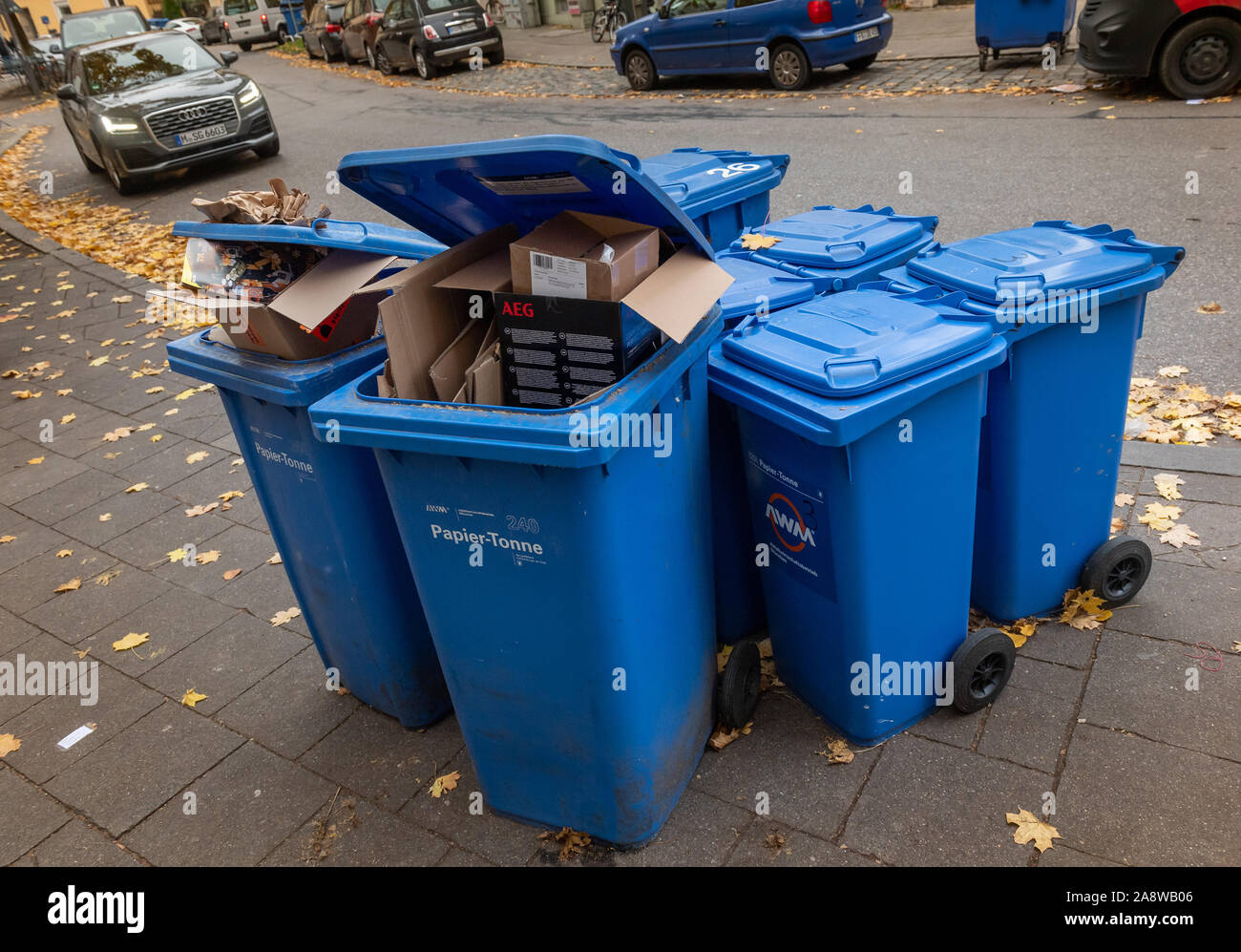 11 November 2019, Bavaria, Munich: Blue trash cans for cardboard and ...