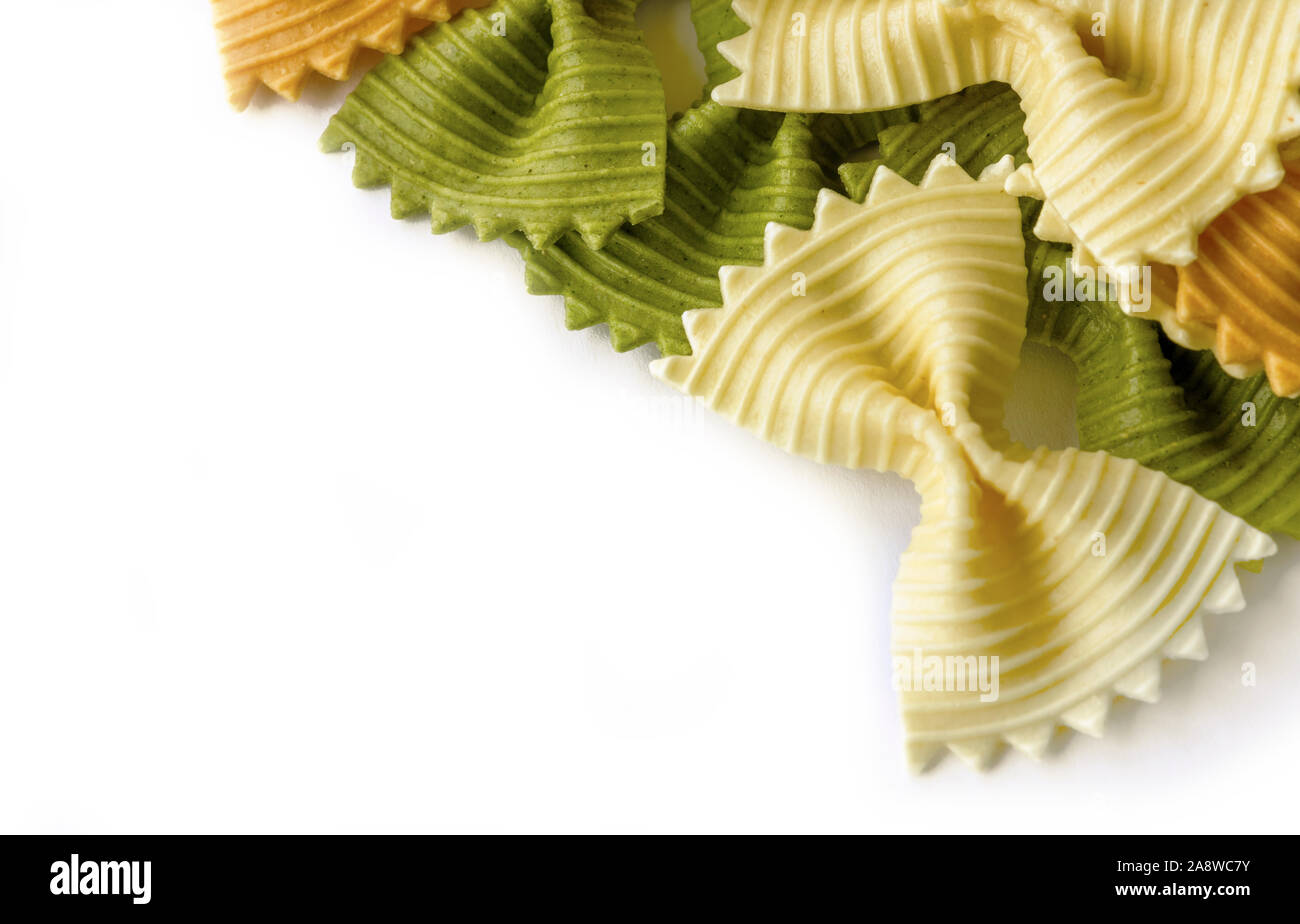 ripped bow pasta, tri-colored isolated on white background for copy ...