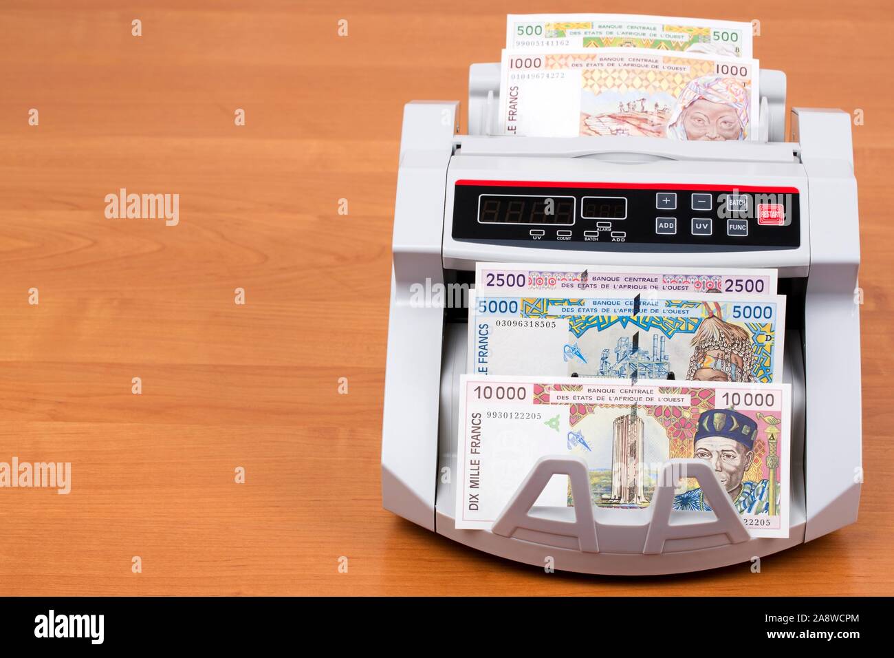 Old West African States money in the counting machine Stock Photo - Alamy