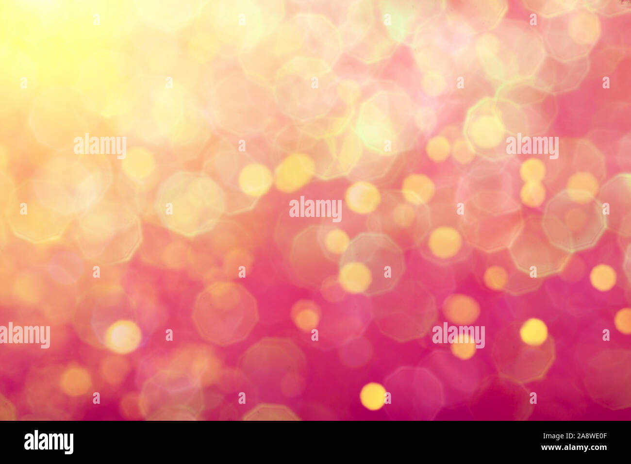 Pink festive background with sparkles in the bokeh. The concept of the ...