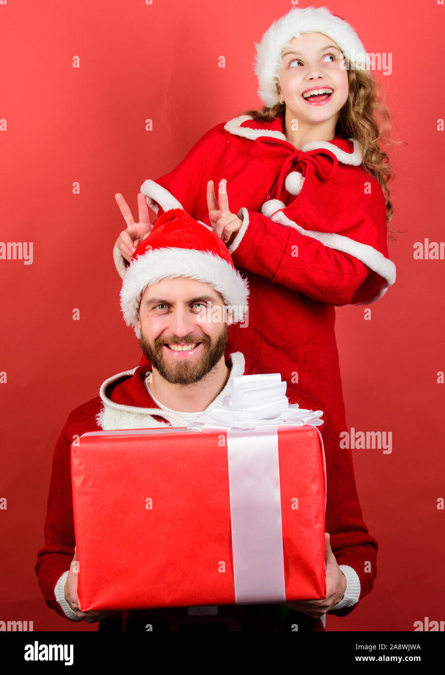 Christmas gift for child. Dad in santa costume and daughter cute kid ...
