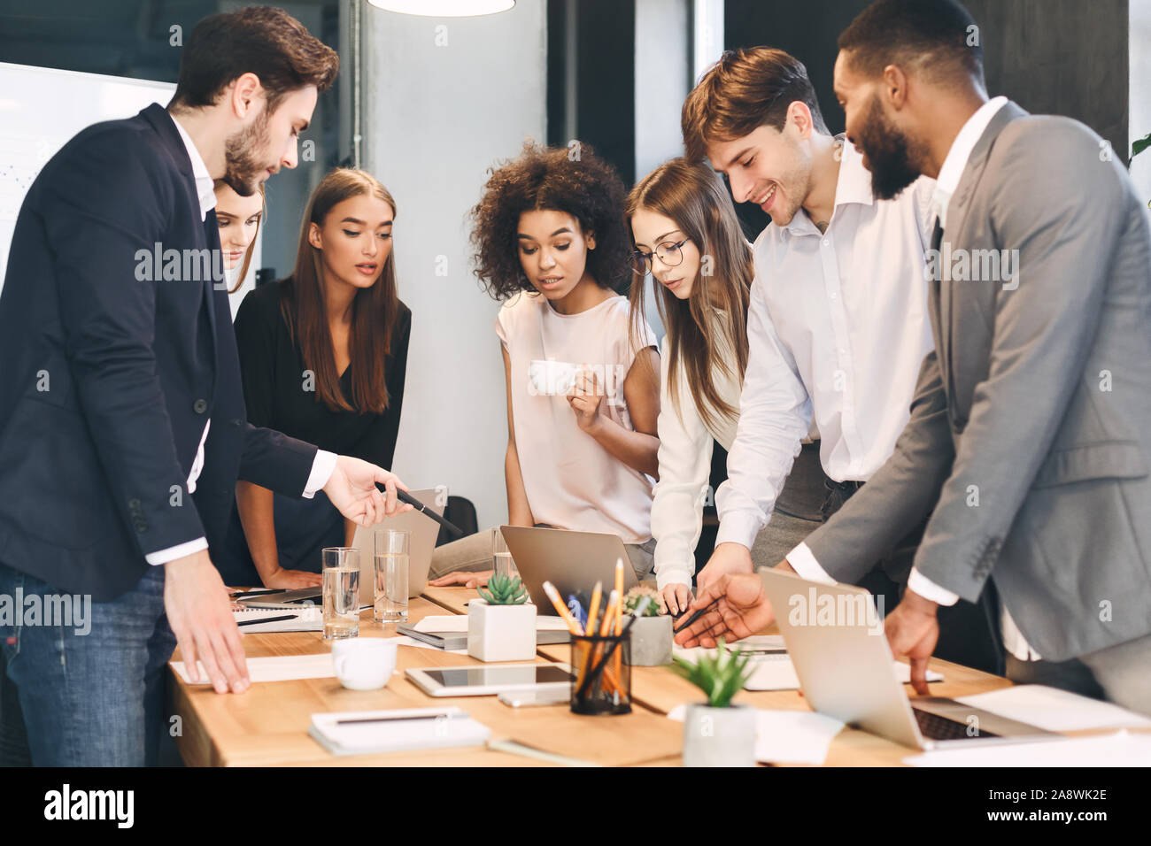Business meeting. Busy people working in office Stock Photo - Alamy