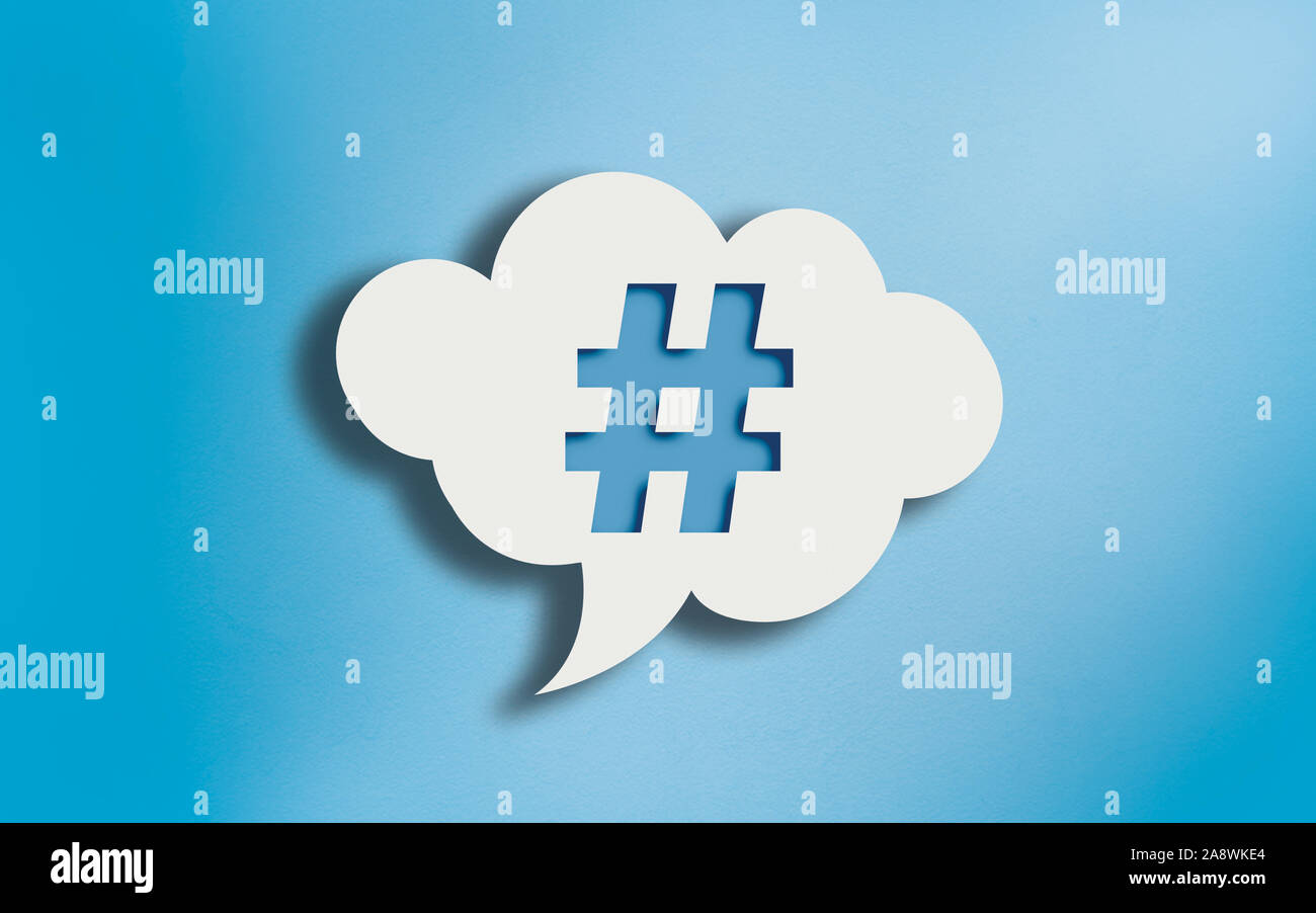 Cut out pound sign icon in a cloud shape speech bubble on blue ...