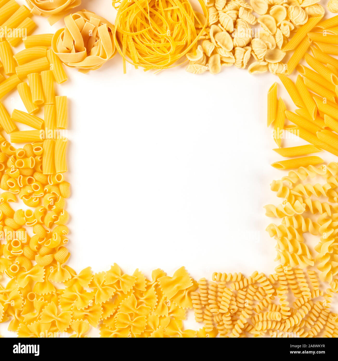 Italian pasta forming a square frame on a white background, overhead ...
