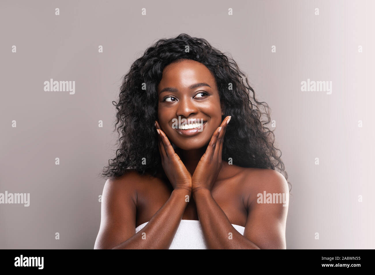 Beautiful black woman happy about her flawless skin on cheeks Stock ...