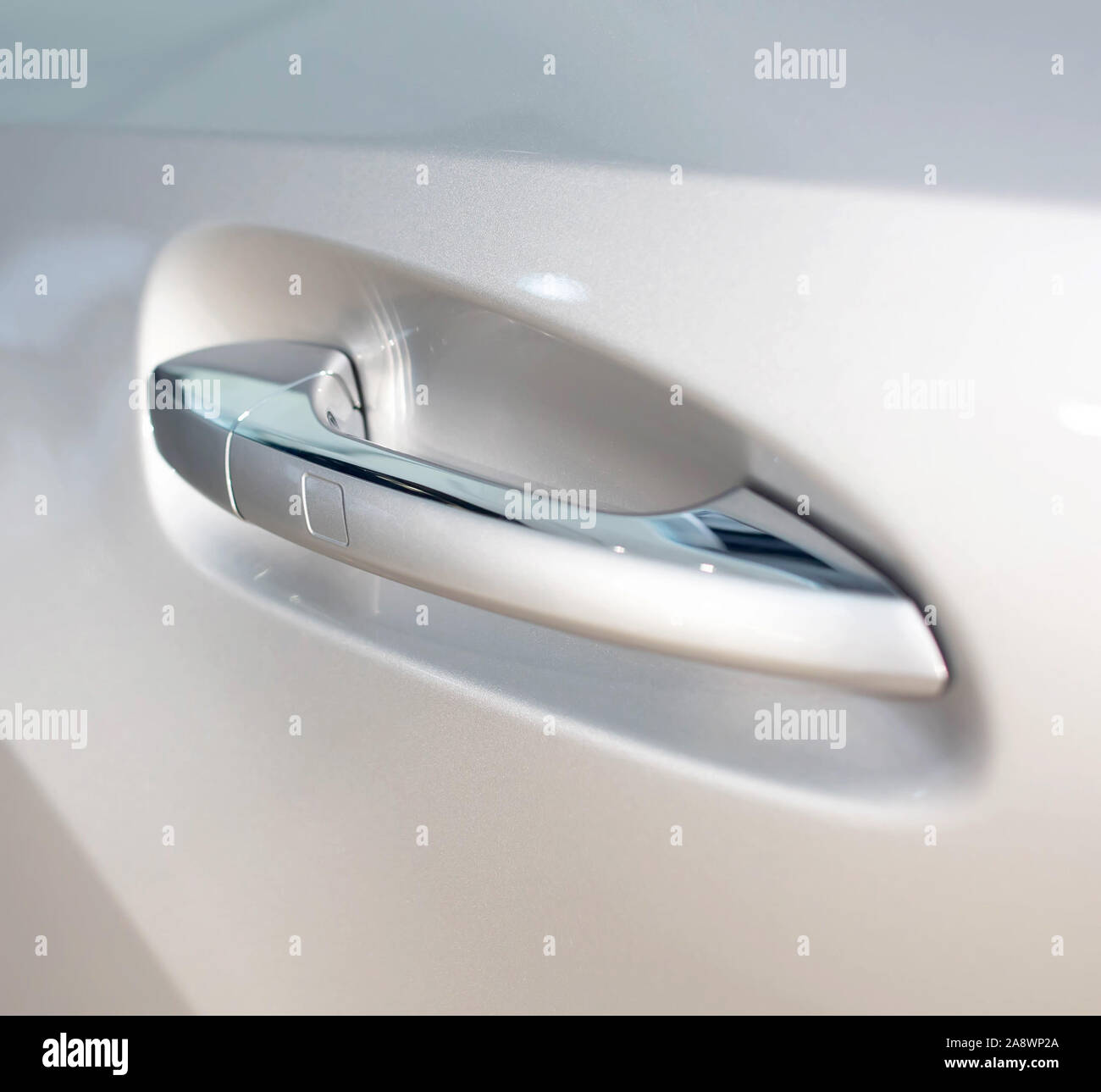 Modern door handle in a car with a button. Keyless Entry System, close ...