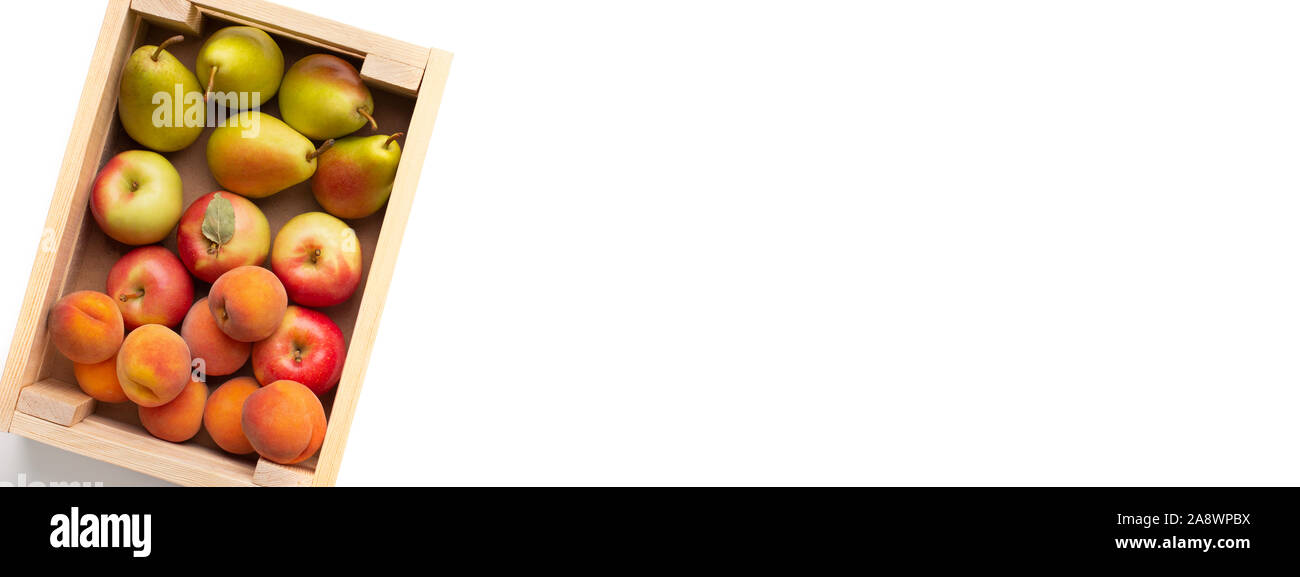 Healthy fruits in wooden box on white background Stock Photo - Alamy