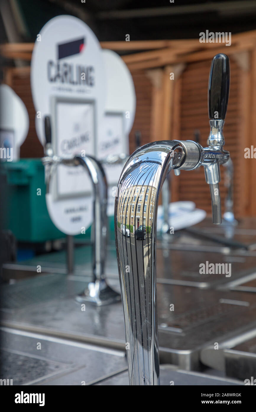 Silver shiny beer tap with a reflection seen outside the Oval cricket ...