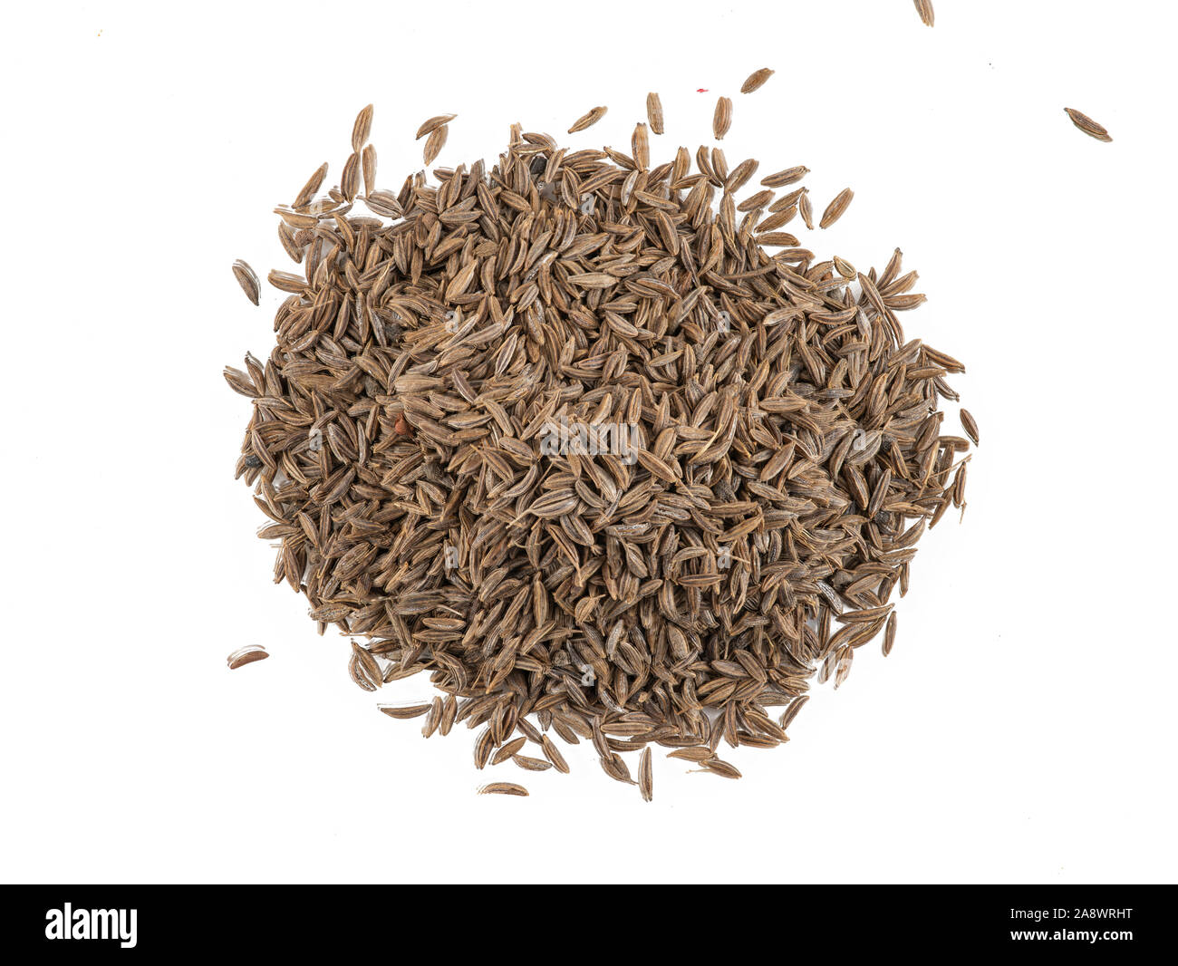 Handful of cumin seeds isolated on white background with copy space for ...