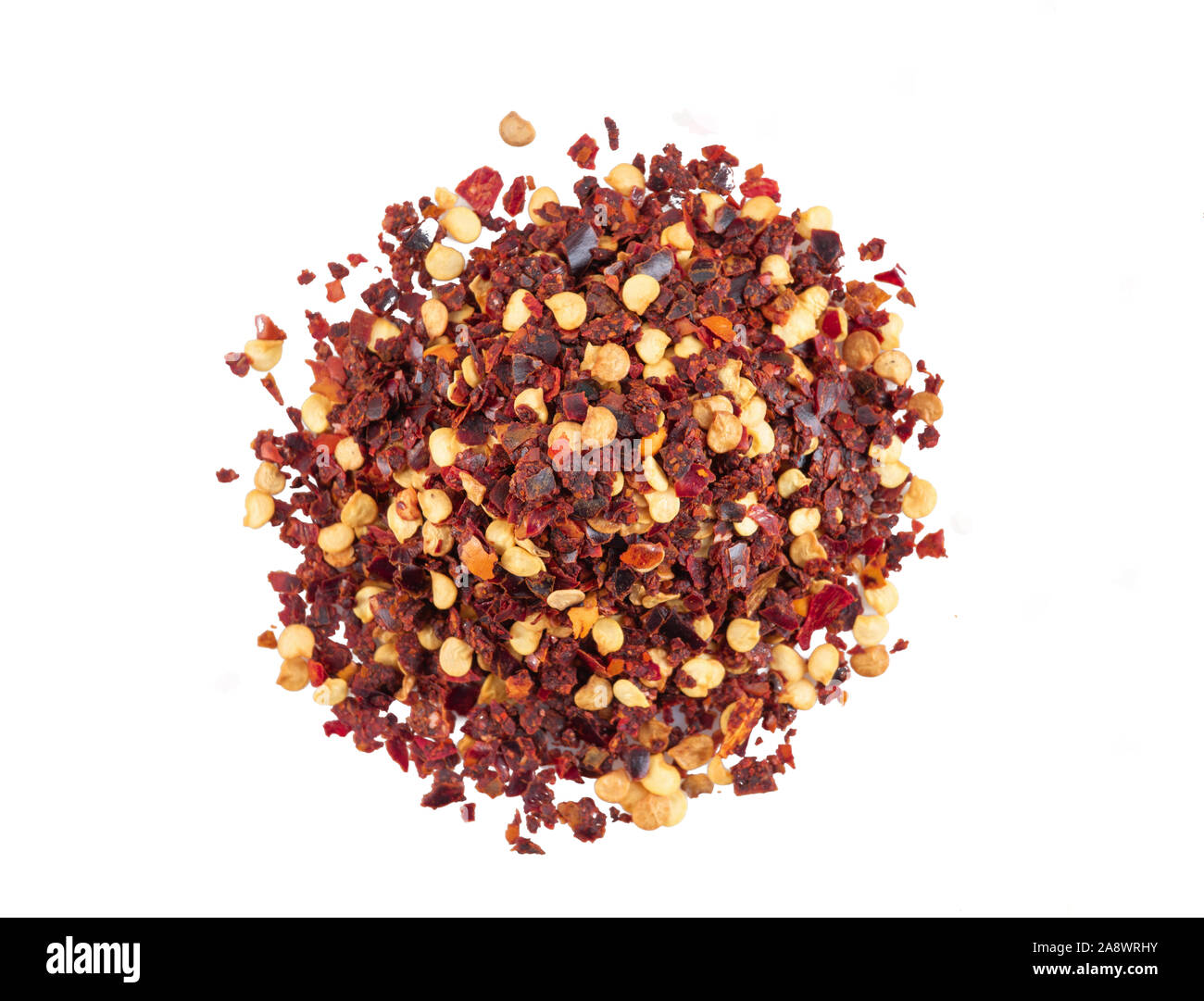 Pile of a chopped, dry chilli pepper isolated on white background with ...