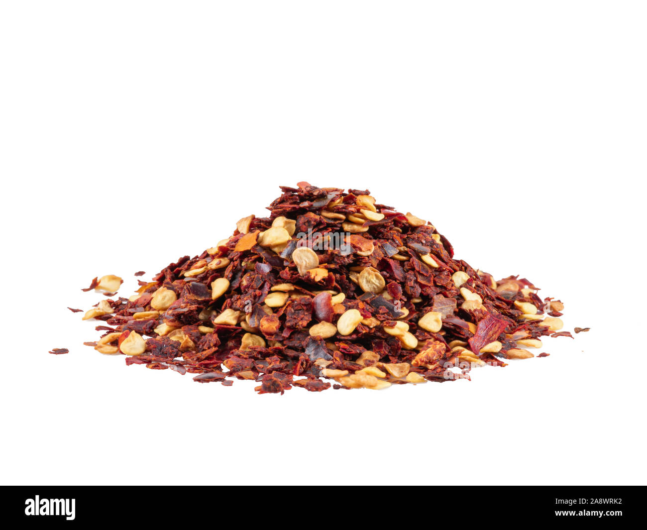 Small heap of some chopped, dry chilli pepper isolated on white ...