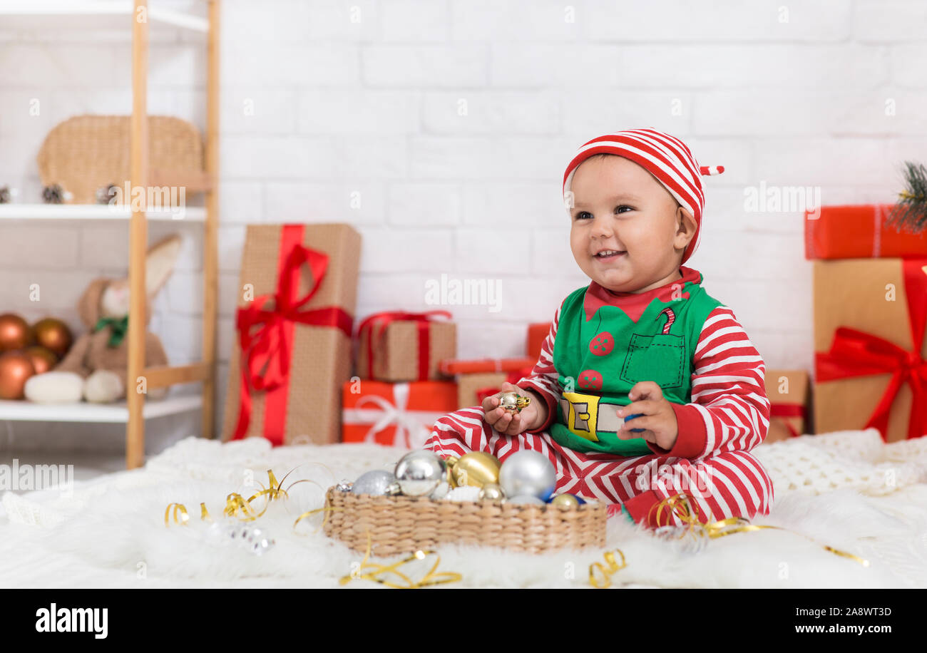 Cute baby child playing red hi-res stock photography and images - Alamy