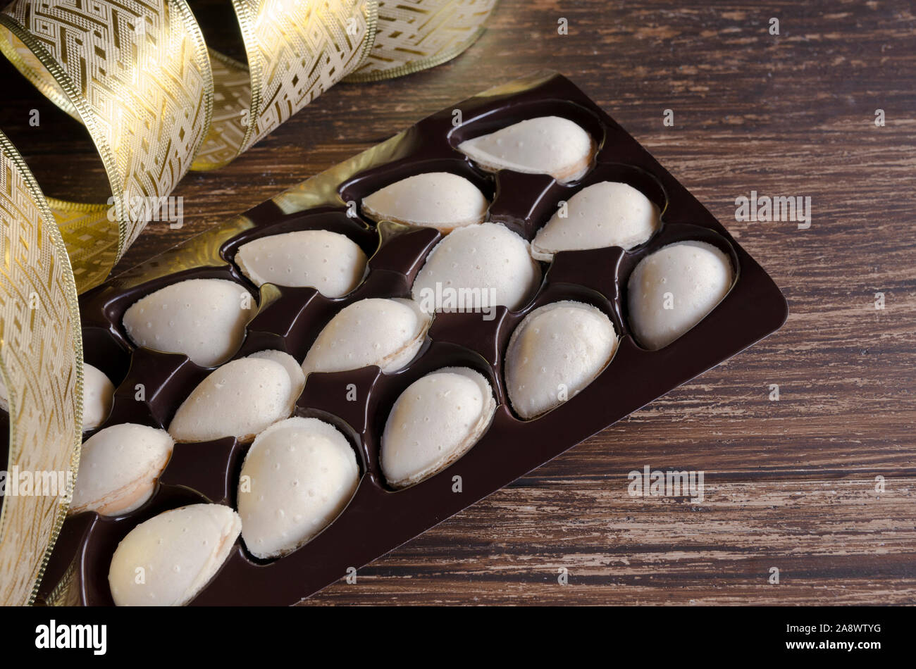 Spanish dessert, almendras rellenas, almond crisps filled with turron ...