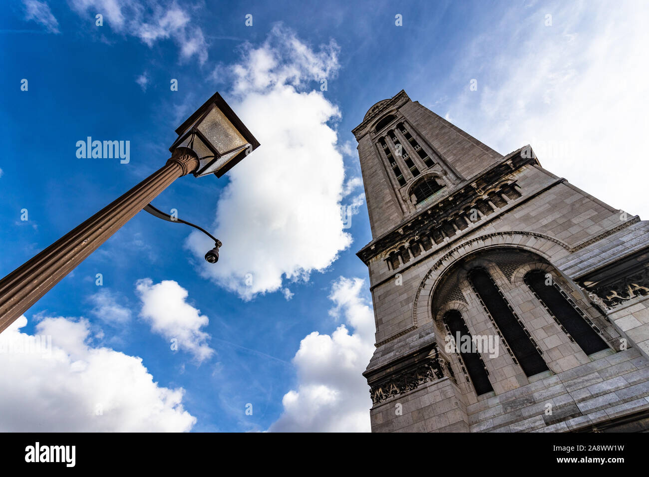 Looking up at vintage Street lamp and rear architecture of Sacre Coeur ...