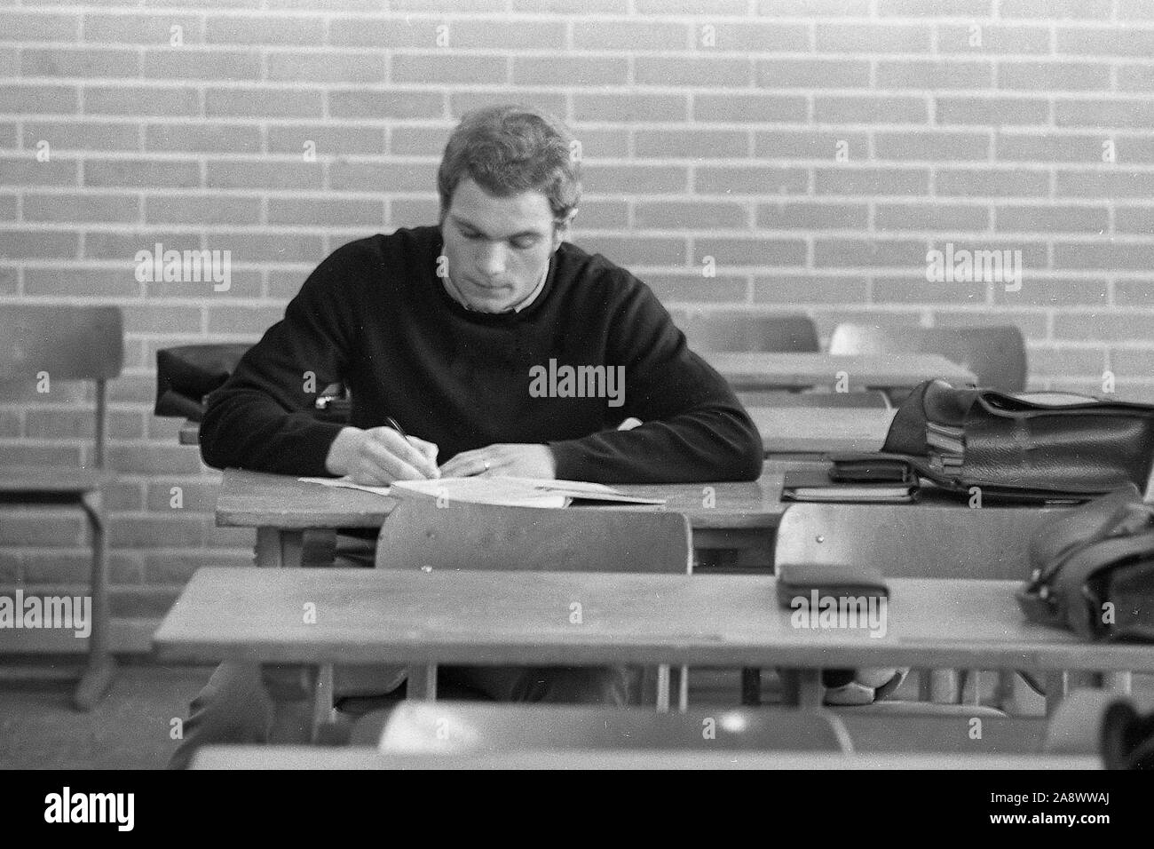 Uli HOENESS (Honess, Honess), footballer, sitting on a school desk and ...
